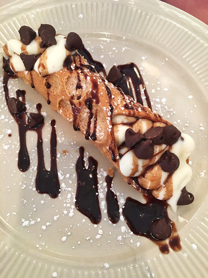 The cannoli—crisp shell, creamy filling, chocolate chips, and that drizzle of chocolate sauce. Resistance is futile, calories be damned.
