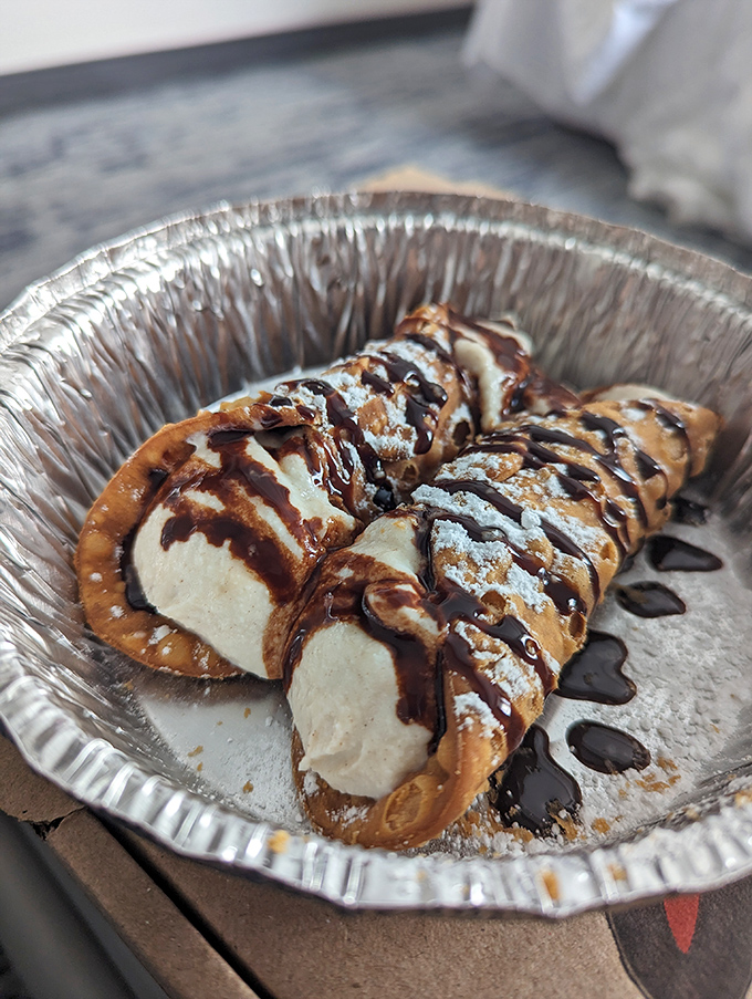 Dessert nirvana arrives in the form of cannoli&mdash;crisp shells filled with sweet cream and drizzled with chocolate. The perfect encore to your pizza performance.