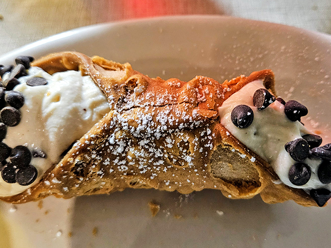 The cannoli &ndash; that perfect crispy shell embracing sweet ricotta filling, dusted with powdered sugar and chocolate chips. Resistance is futile.