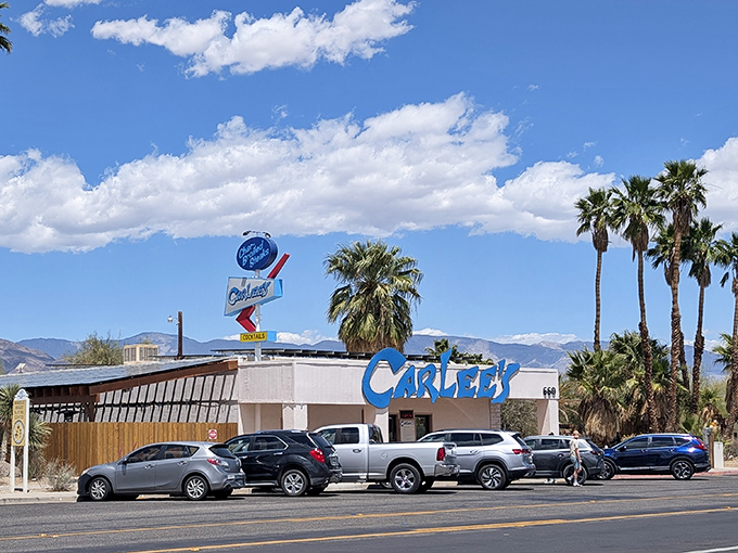 Carlee's Restaurant brings that classic roadside Americana vibe, where neon signs and palm trees create the perfect California postcard moment.