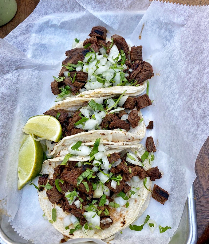 These street-style tacos showcase carne asada in its purest form—tender, charred perfection topped with nothing but the essentials.