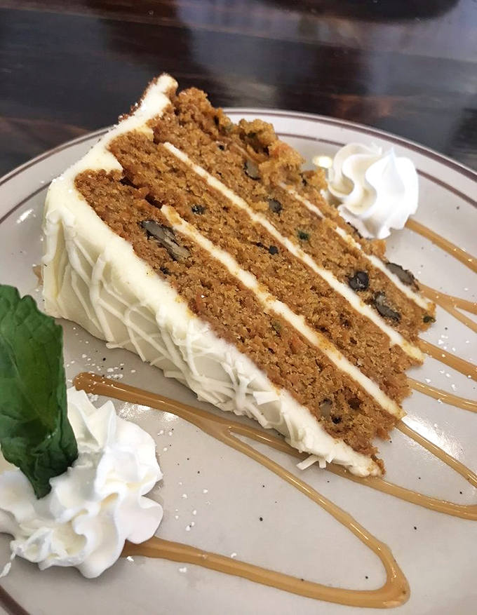 Carrot cake that doesn't pretend to be health food, with layers of cream cheese frosting thick enough to make your dentist wince with delight.