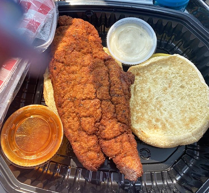 This catfish sandwich proves that sometimes the best comfort food comes from unexpected lakeside locations.