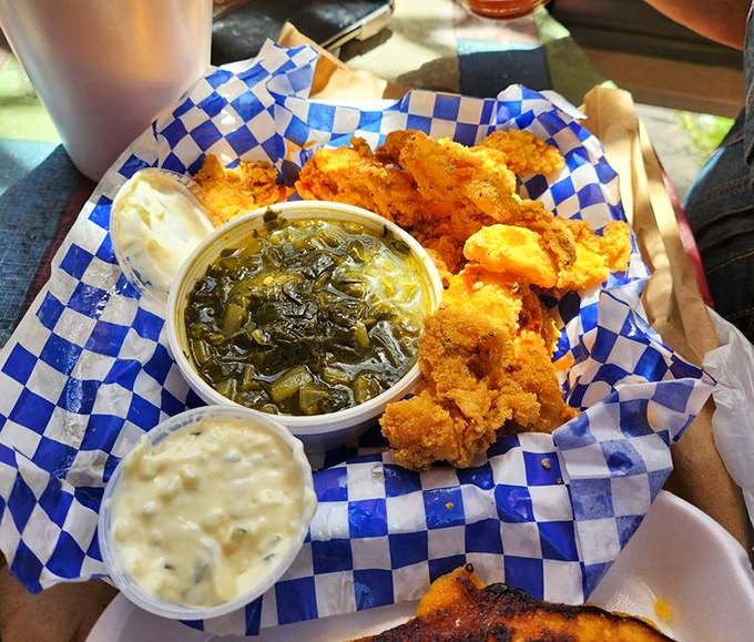 The holy trinity of Southern cooking: perfectly fried catfish, mac and cheese that could make you weep, and collard greens that taste like they've been simmering since Tuesday.