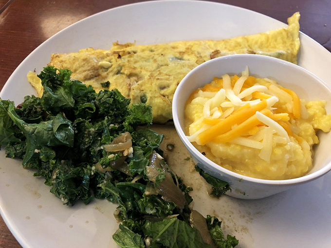 An omelet that knows its supporting cast matters&mdash;paired with saut&eacute;ed greens and cheese grits that could make a Southerner weep with joy.