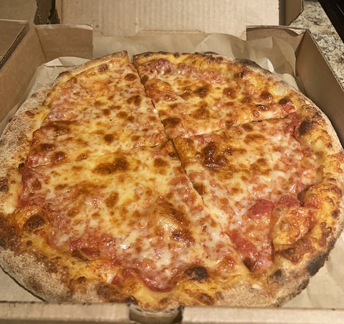 The classic cheese pizza&mdash;proof that sometimes the simplest things in life require the most expertise to perfect.