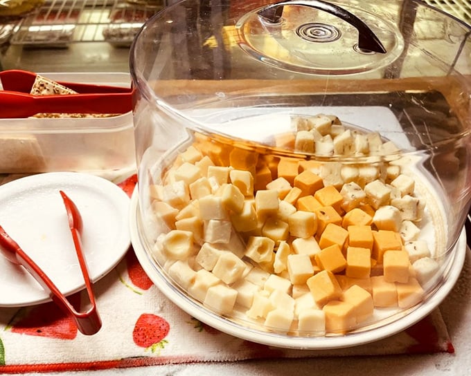 Cheese cubes under glass &ndash; the buffet appetizer that somehow tastes better when you're using those little tongs to grab "just one more."