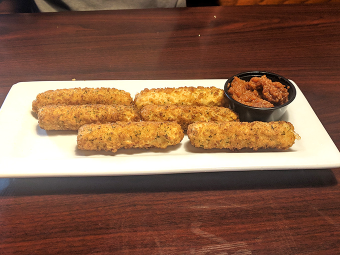 These golden-brown mozzarella sticks aren't your average appetizer &ndash; they're the overachievers of the fried cheese world, served with a dipping sauce worth fighting over.