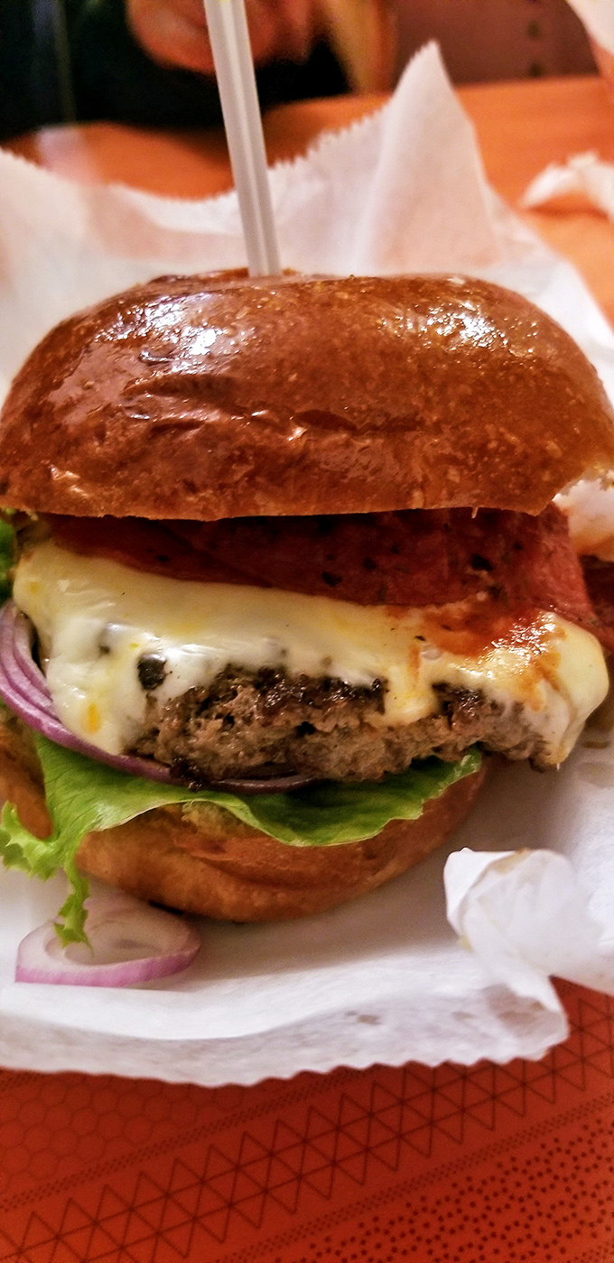 The cheeseburger rivals its more famous sandwich sibling &ndash; juicy, perfectly proportioned, and dressed for success on a glossy brioche throne.