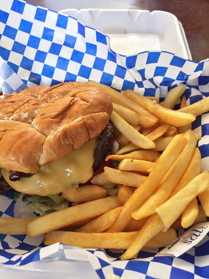 Sometimes you just need a good burger. This classic cheeseburger with golden fries proves that Tori's Place excels beyond their Southern specialties.