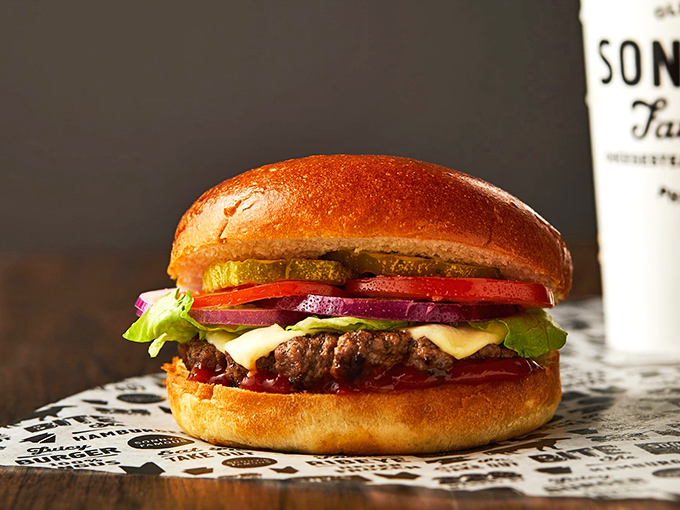 This isn't just a burger &ndash; it's a towering masterpiece of beef, cheese, and fresh veggies that makes you want to unhinge your jaw like a python.