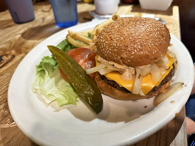 The cheeseburger&mdash;America's greatest contribution to world peace. This one comes with the obligatory pickle spear standing guard.