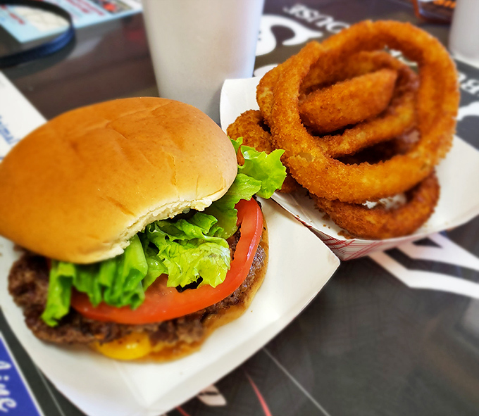 Simple perfection: fresh lettuce, ripe tomato, melted cheese, and a patty with the kind of sear that makes grill masters weep with joy.