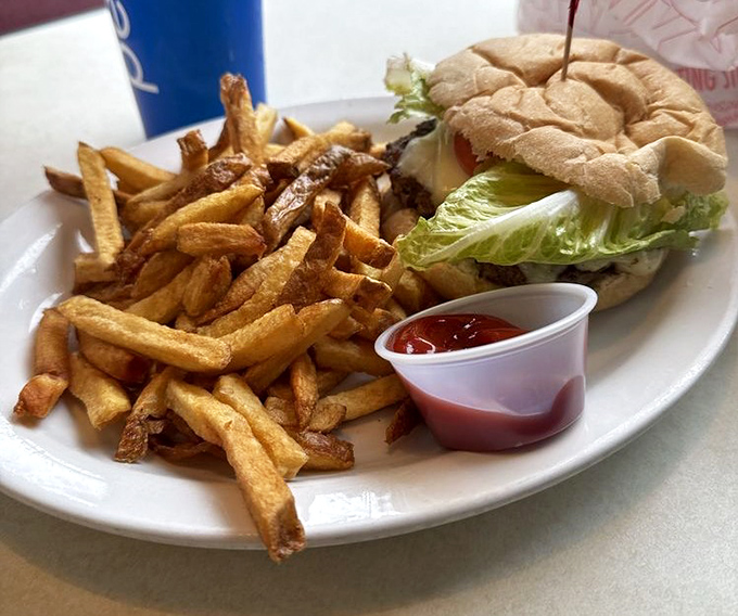 Sometimes you need a break from sticky bun bliss. This classic burger and fries combo proves Mr. Sticky's savory game is equally strong.