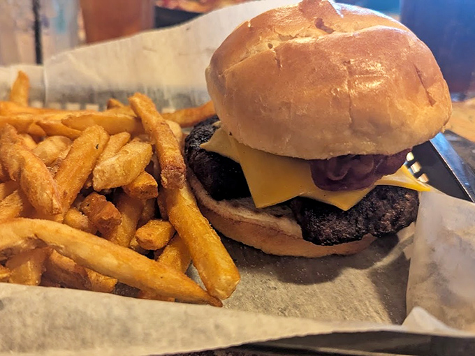 A burger that requires both hands and a strategy. Those golden fries aren't just a side&mdash;they're essential supporting players in this delicious drama.