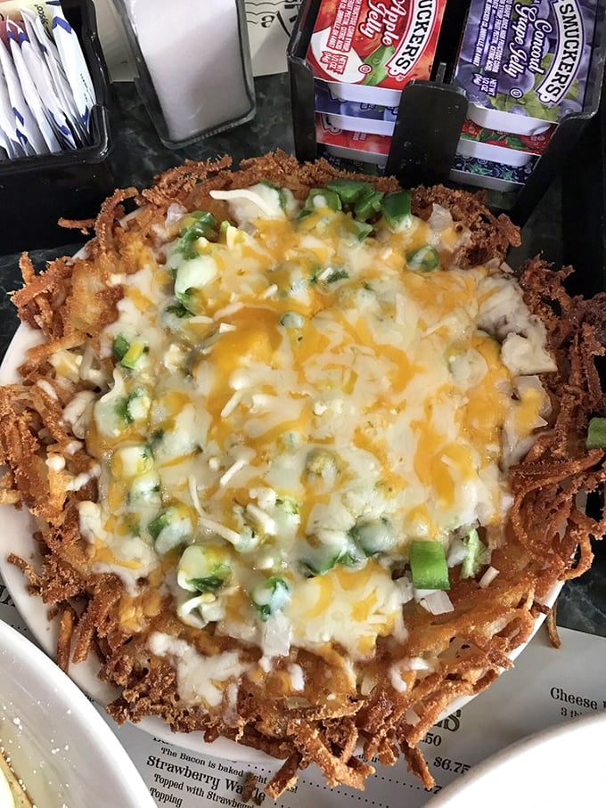 This isn't just hash browns&mdash;it's a crispy potato nest cradling melted cheese and green peppers. Breakfast architecture at its finest.
