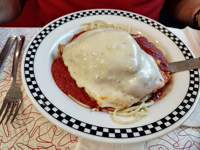 When Italian cuisine meets diner magic: chicken parmesan with melted cheese cascading over marinara, proving diners can do it all.
