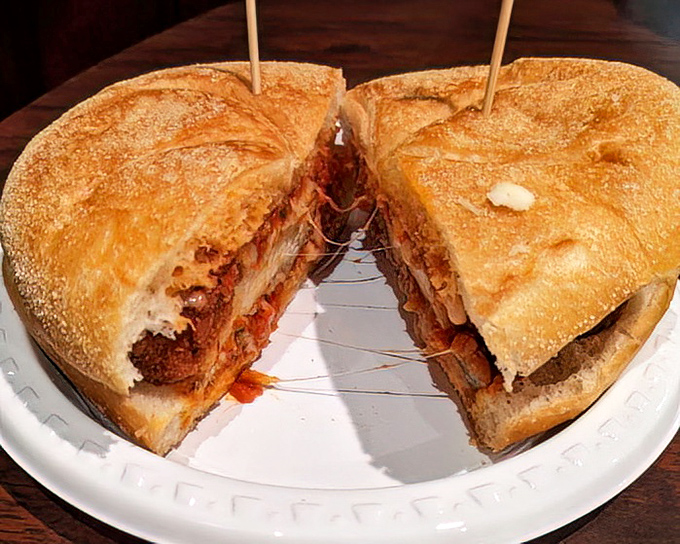 A sandwich that demands to be eaten with both hands. This meatball creation is what Italian-American comfort food dreams are made of.