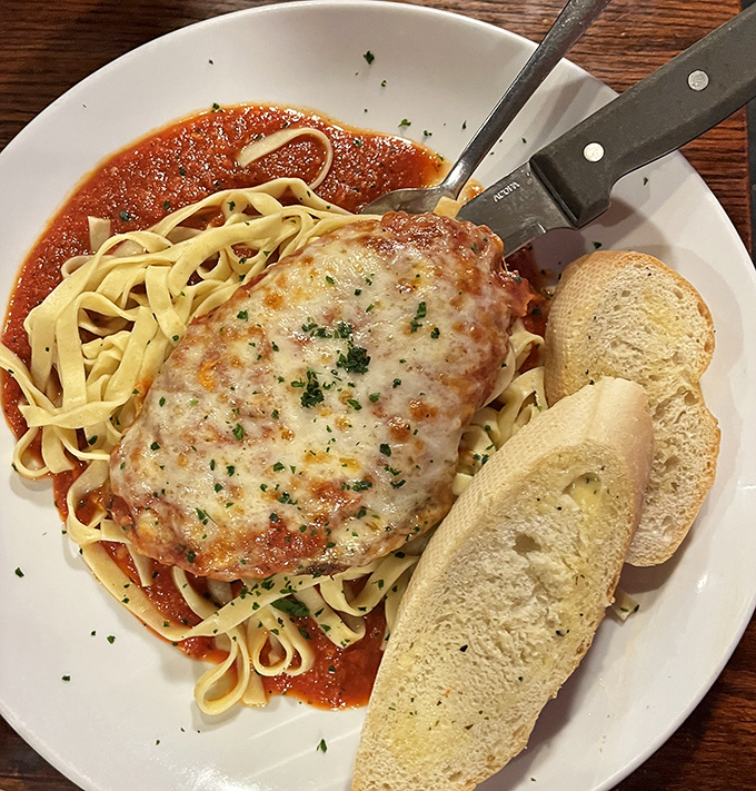 Chicken Parm done right &ndash; when the cheese blanket is this perfect, you know you're in capable culinary hands.