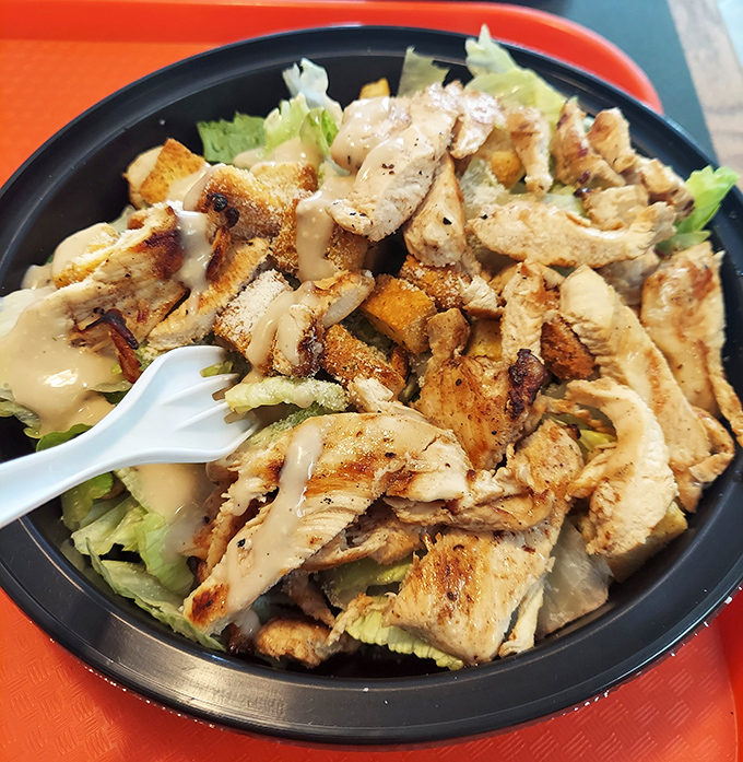 When you're trying to be "healthy" but still want flavor. Grilled chicken atop fresh greens with house dressing&mdash;the compromise that doesn't feel like one.