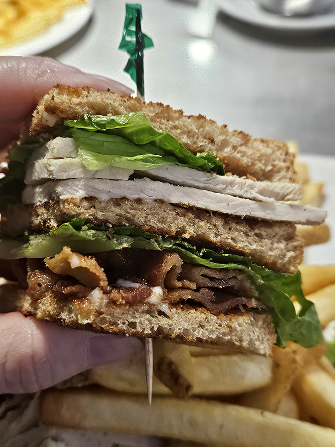 The club sandwich &ndash; architecture you can eat! Layers of turkey, bacon, and crisp lettuce create the skyscraper of sandwiches, secured with that iconic toothpick.
