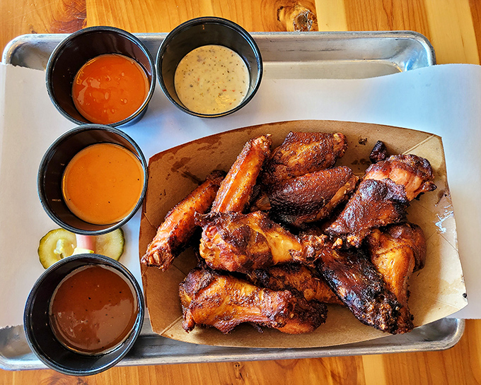 These wings, surrounded by a United Nations of sauces, prove that chicken parts can reach heights of flavor previously reserved for their four-legged farm companions.