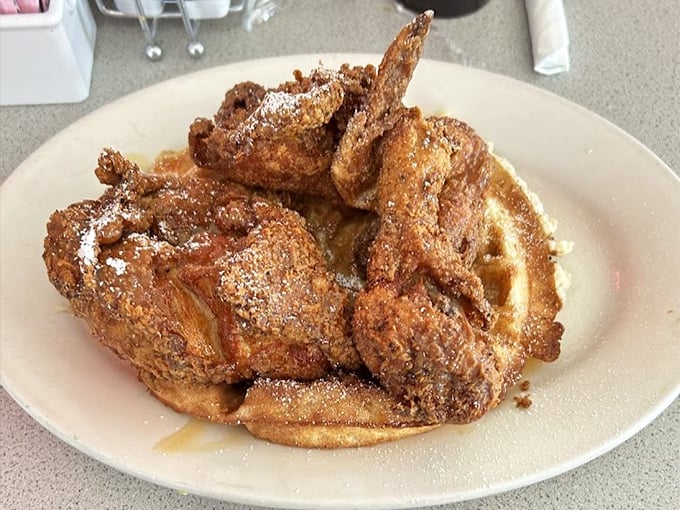 These aren't just wings; they're a testament to the beauty of simplicity&mdash;crispy, seasoned, and perched atop a waffle throne.