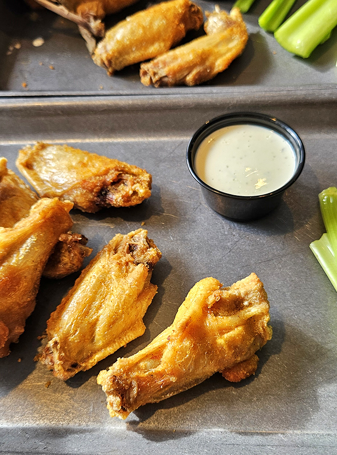 These wings aren't just crispy; they're the kind that make you wonder if you should cancel your other dinner plans for the week.