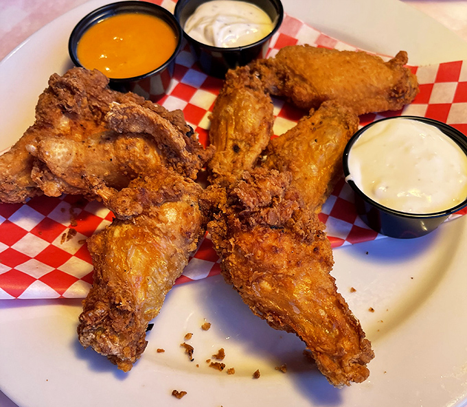 Wings that make you question why chickens don't rule the world with flavor this commanding. The dipping sauces are just showing off.