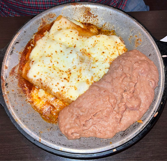 These enchiladas don't need fancy presentation to impress&mdash;they let the melted cheese and rich sauce do all the talking.