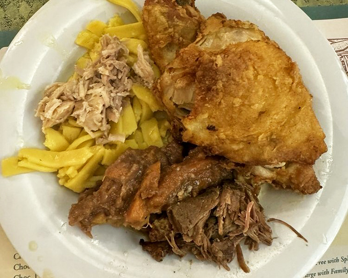 The holy trinity of Amish comfort: golden fried chicken, buttery noodles, and pot roast that falls apart faster than your diet resolutions.