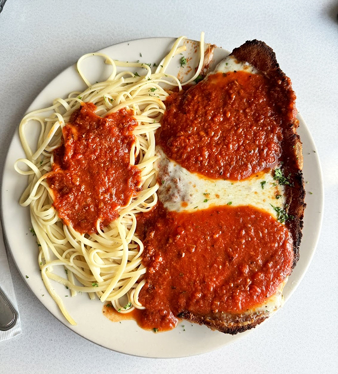 Chicken parmesan that would make any Italian grandmother nod in approval. The pasta-to-sauce ratio? Mathematical perfection.