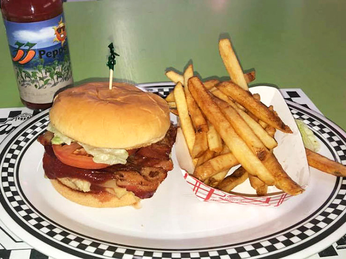 A chicken sandwich that requires both hands and a strategy, flanked by fries standing at attention. This isn't fast food&mdash;it's good food that's worth the wait.