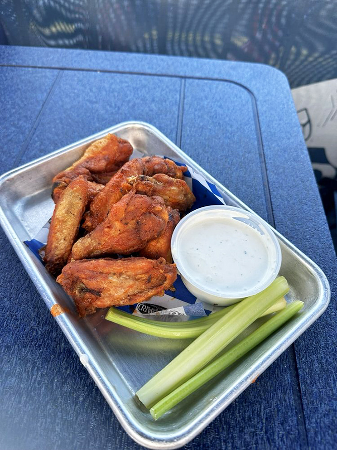 These wings aren't just crispy&mdash;they've achieved that mythical texture that makes you wonder if the kitchen has somehow defied the laws of culinary physics. 