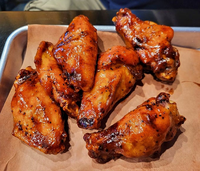 These wings aren't just cooked&mdash;they're transformed through smoke and fire into crispy-skinned vessels of juicy perfection.