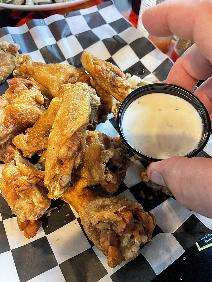 Wings that achieve the holy grail: crispy exterior, juicy interior, and a dipping sauce worth bottling and taking home.