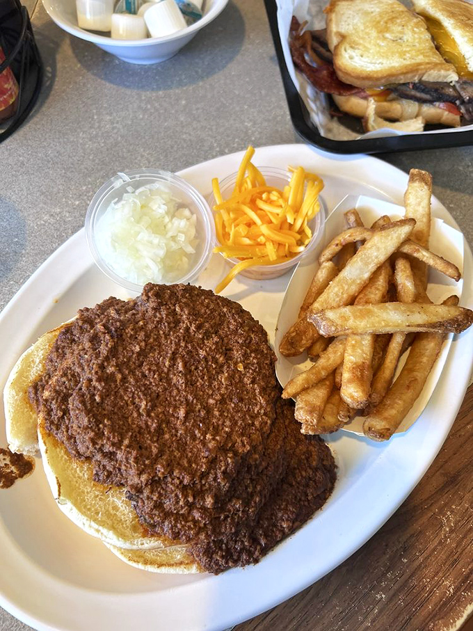 This isn't just a chili cheeseburger &ndash; it's a glorious mess that requires strategic planning, multiple napkins, and zero regrets.