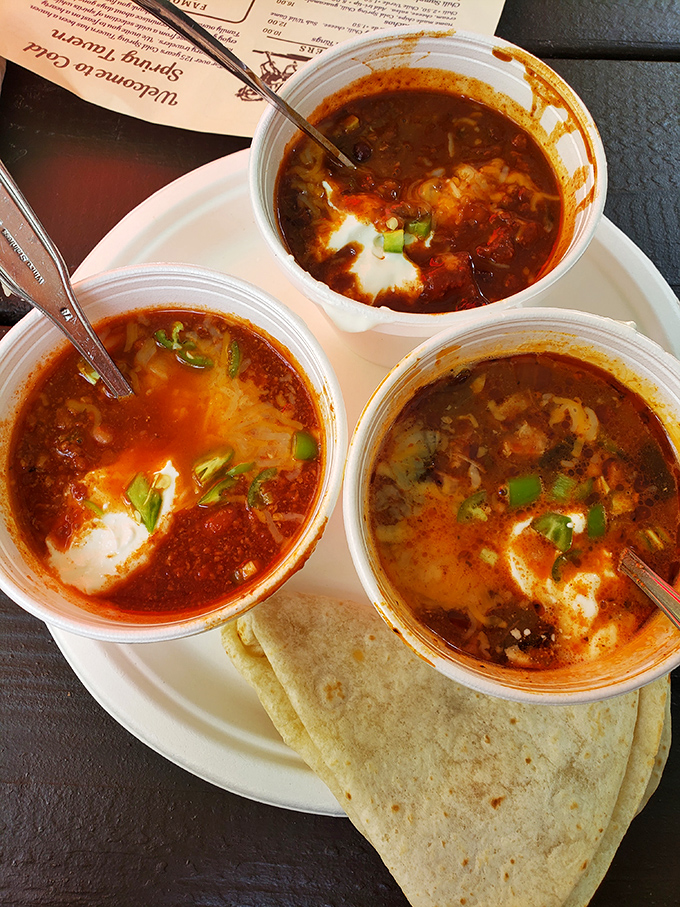 The chili sampler: three steaming cups of frontier fuel, each telling a different spicy story of the California trail.