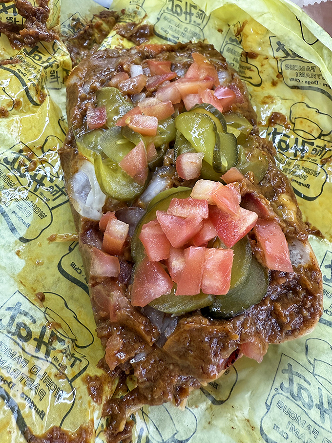 The chili dog gets the royal treatment with pickles and fresh tomatoes, proving The Hat knows how to elevate even the classics.