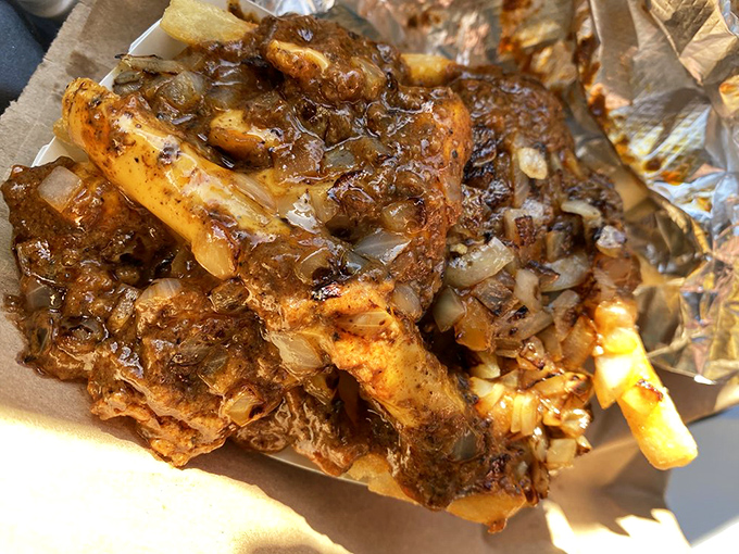 Chili cheese fries that look like they're auditioning for a comfort food hall of fame induction ceremony.