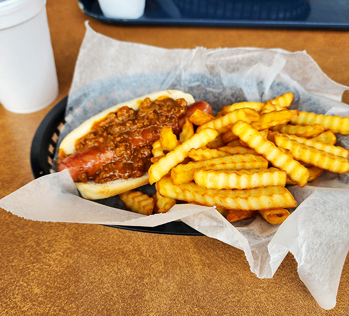 The humble hot dog elevated to art form &ndash; where chili, bun, and dog achieve perfect harmony like a culinary jazz trio.