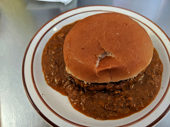 When a burger gets baptized in homestyle chili, something magical happens. This isn't just a sandwich &ndash; it's comfort in edible form.