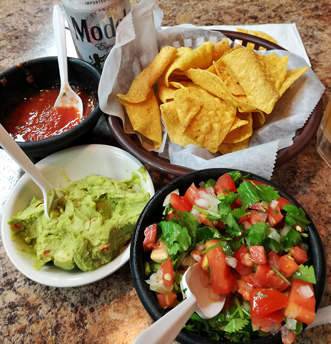 The holy trinity of Mexican starters: fresh pico de gallo, velvety guacamole, and crispy tortilla chips. The appetizer that's secretly a meal.