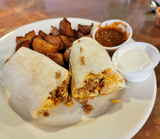 A burrito substantial enough to require a building permit, flanked by home fries that didn't dare come from a freezer bag.