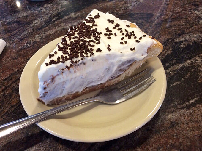 A slice of cream pie that makes you consider ordering a second piece before you've finished the first. Strategic dessert planning at its finest.