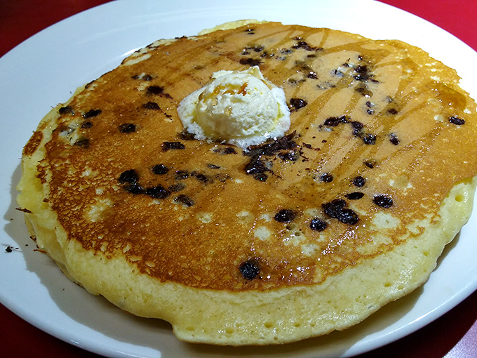 A chocolate chip pancake that's practically winking at you. That pat of butter slowly melting on top is nature's way of saying "good morning, beautiful."