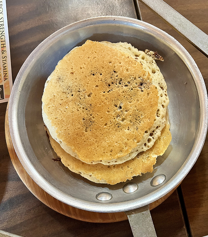 Golden pancakes that look like they're auditioning for a breakfast commercial. Fluffy, golden, and ready for their maple syrup bath.
