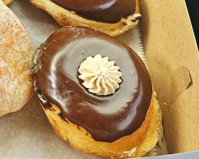 The chocolate cream donut: proof that sometimes the best surprises come wrapped in chocolate.