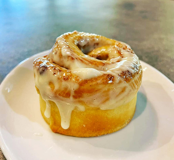 This cinnamon roll isn't playing fair&mdash;all swirled perfection and glistening icing. Resistance is futile, just embrace the inevitable sugar rush.