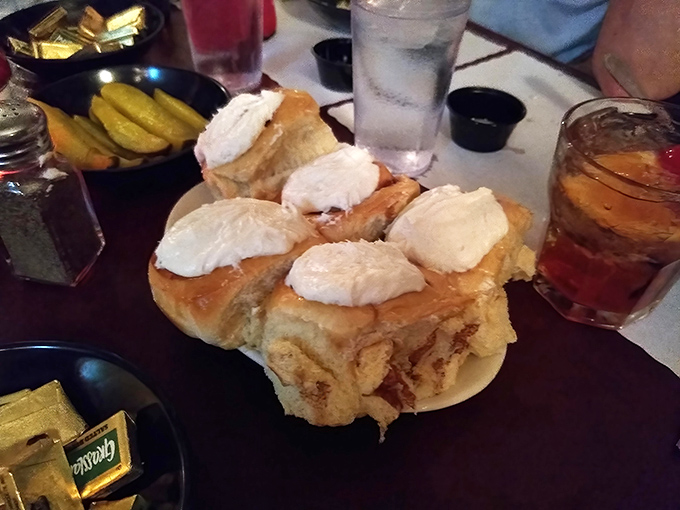 Pillowy cinnamon rolls topped with clouds of cream cheese frosting &ndash; because at a proper supper club, dessert isn't an afterthought, it's a grand finale.